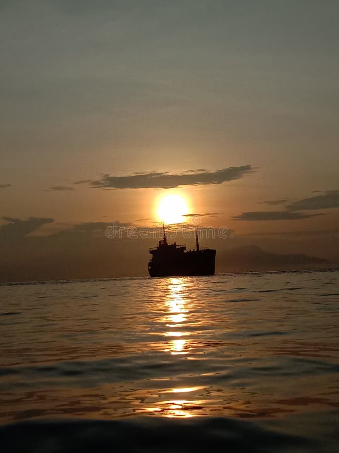 Beautiful Sunshine Behind the Ship Stock Photo - Image of beach, dusk ...