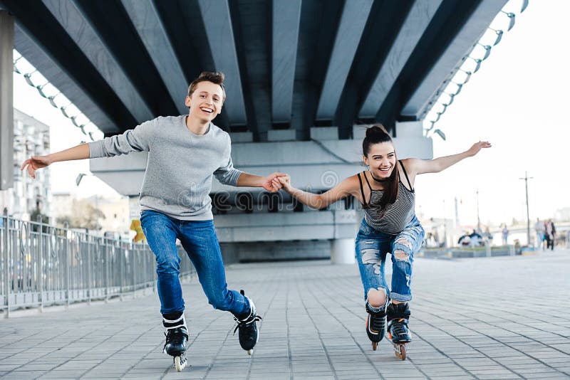Beautiful Sweet Couple Riding on Roller Skates Stock Image - Image of ...