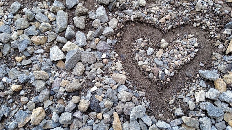 The Beautiful Symbol of Love Engraved among the Pebbles Stock Photo ...