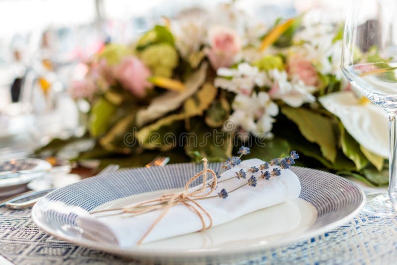Beautiful Table Setting with Folded Napkins and Floral Decorations ...