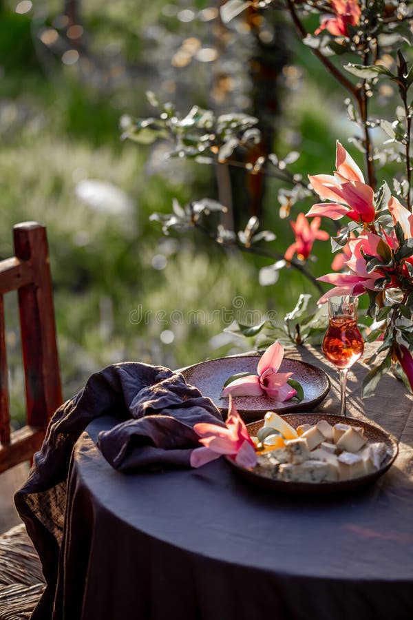 Beautiful Table Setting in Garden on Sunset Light. Table Decorated with ...