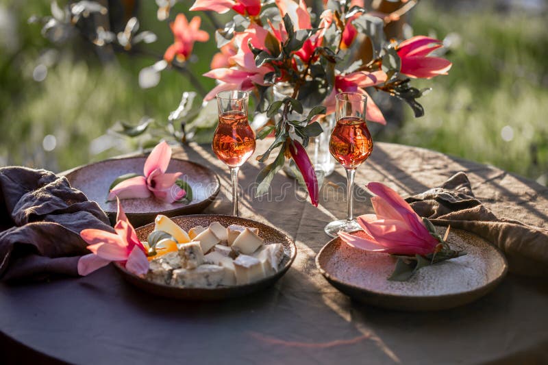 Beautiful Table Setting in Garden on Sunset Light. Table Decorated with ...