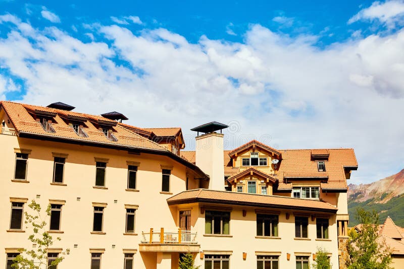 Beautiful Tan and Red Roofed Structures Against White and Blue Sky ...