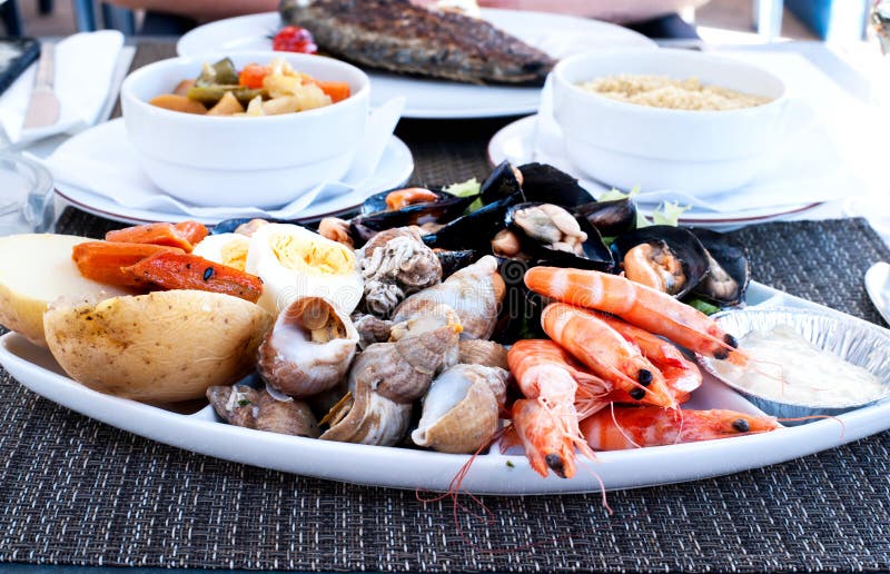 Seafood on the table stock photo. Image of cultures - 303827062