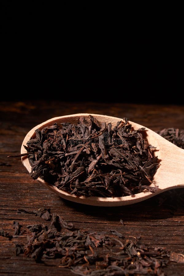 Beautiful Tea in a Wooden Spoon on a Black Background. Isolated Stock ...