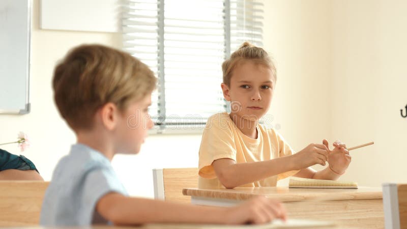 Beautiful Teacher Explaining Test while Caucasian Boy Doing Classwork ...