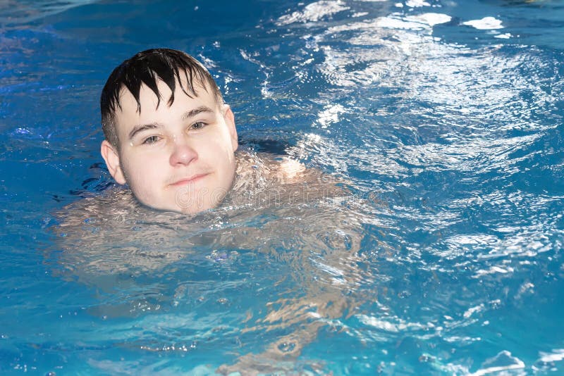 A Beautiful Teen Swims in Pool Stock Image - Image of happy, active ...
