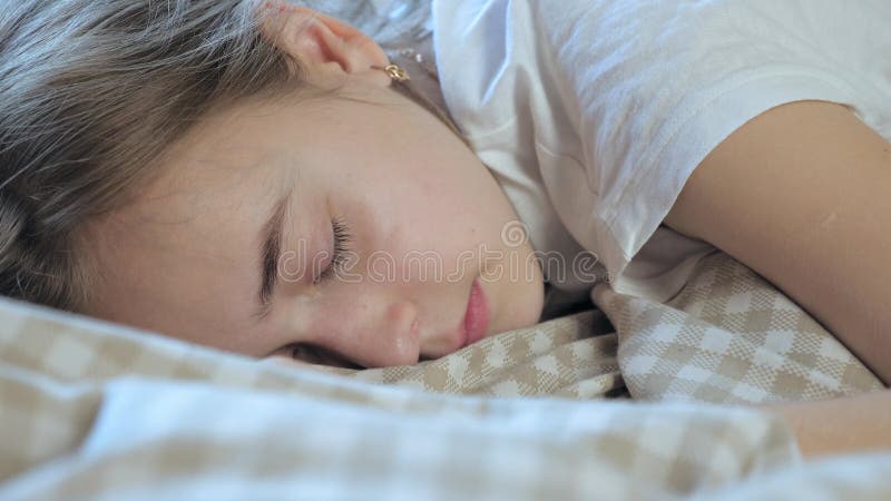 A Beautiful Teenage Girl Is Sleeping In Her Bed The Girl Wakes Up From