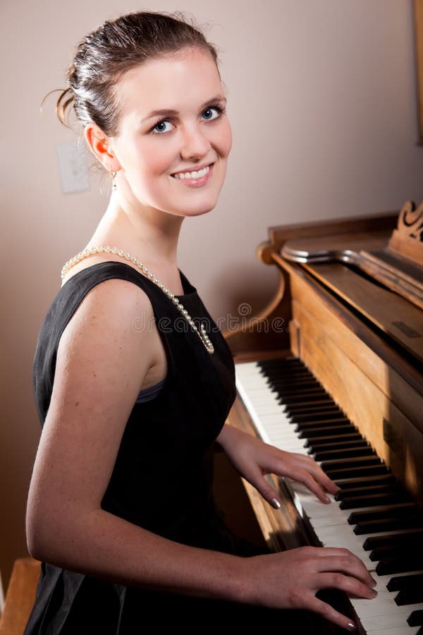 Smiling Piano Teacher stock image. Image of instrument - 1721967