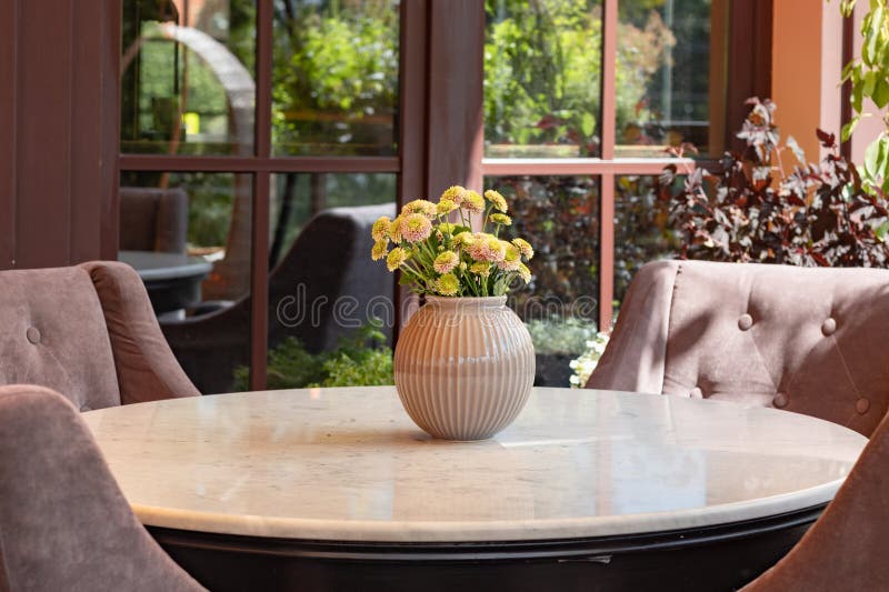Beautiful Terrace or Balcony with a Table, Soft Chairs and Flowers ...