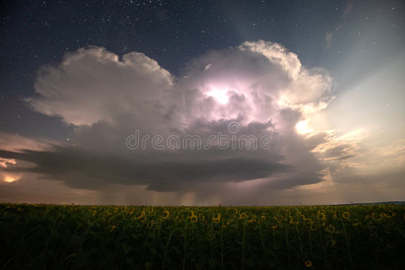 Beautiful Thunderstorm with Clouds, Lightning and Moon Over a Field ...