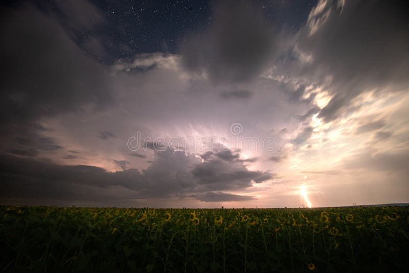 Beautiful Thunderstorm with Clouds, Lightning and Moon Over a Field ...