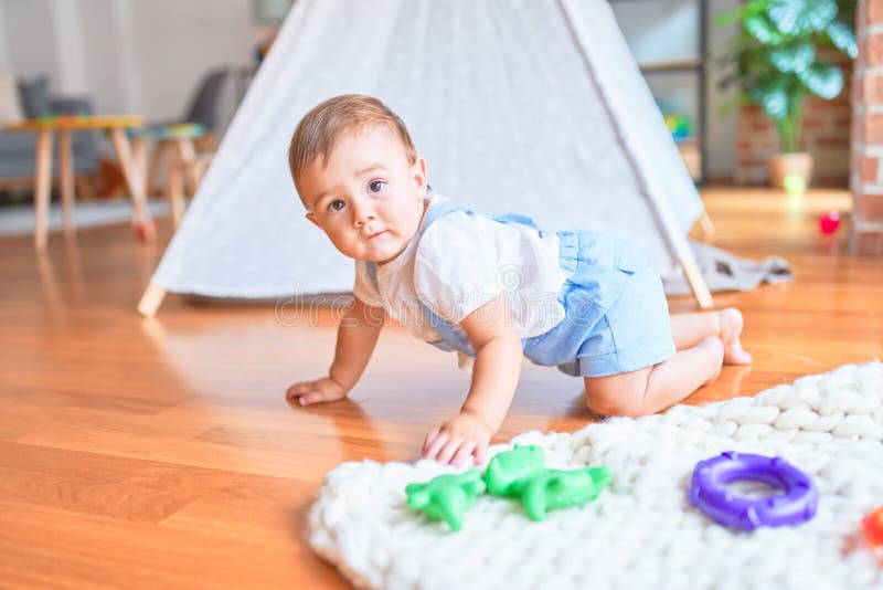 Beautiful Toddler Crawling at Kindergarten Stock Photo - Image of ...
