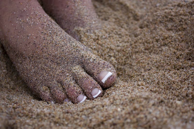 Beautiful toes in the sand stock image. Image of close - 12402317