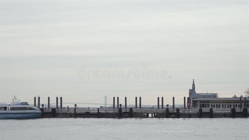 The Serene Waterfront Dock is Set Against an Overcast Sky, Adding To ...