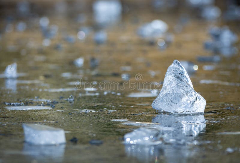 Beautiful Triangular Piece of Ice and Its Reflection on a Frozen Lake ...