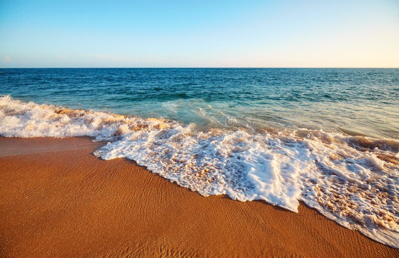 Beautiful Tropical Beach at Sunset Stock Photo - Image of ocean, wave ...
