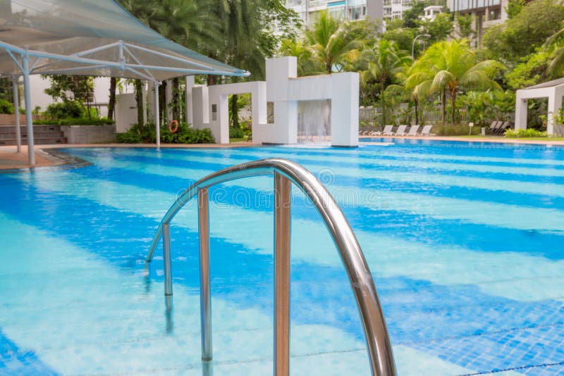 Beautiful Turquoise Swimming Pool with Metal Rail Stock Image - Image ...