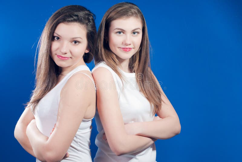 Beautiful Two Young Woman Standing Back To Back Stock Image - Image of ...