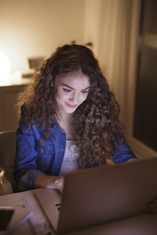 A Beautiful University Student Having Evening Online Class, E-learning ...