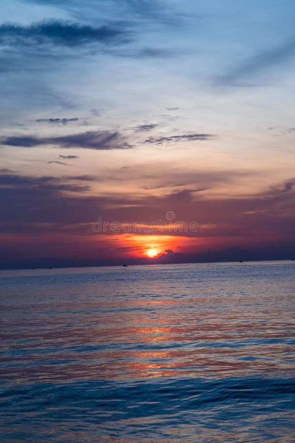 Beautiful Vertical Shot of the Sunset Reflected in the Sea Creating a ...