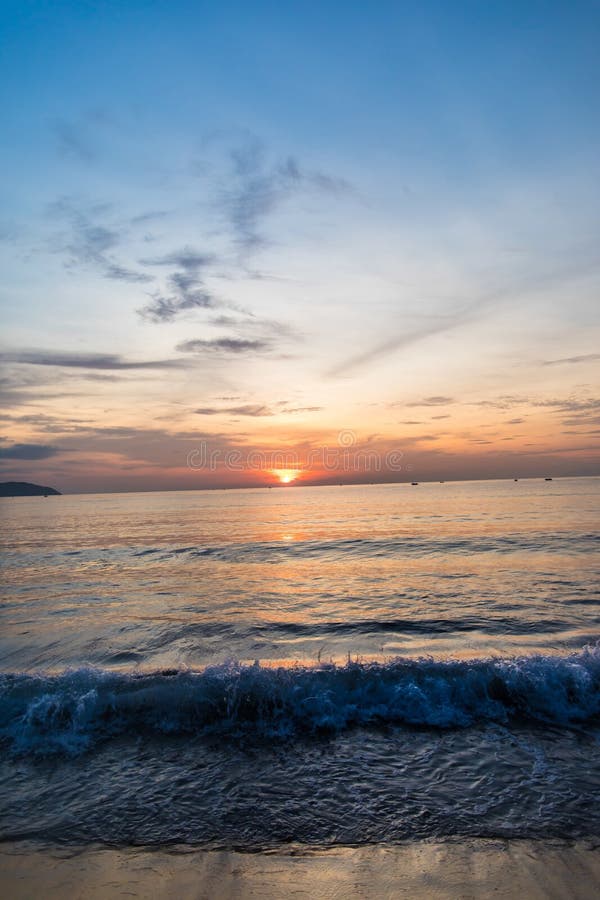 Beautiful Vertical Shot of the Sunset Reflected in the Sea Creating a ...