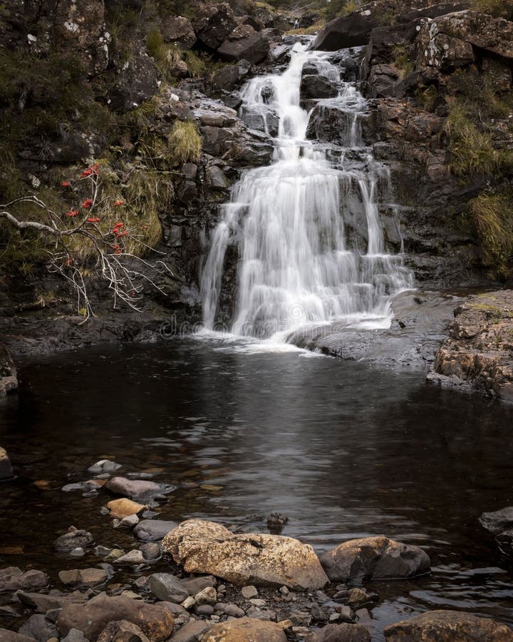 Beautiful Vertical View of the Waterfall Flowing Over the Rocky Cascade ...