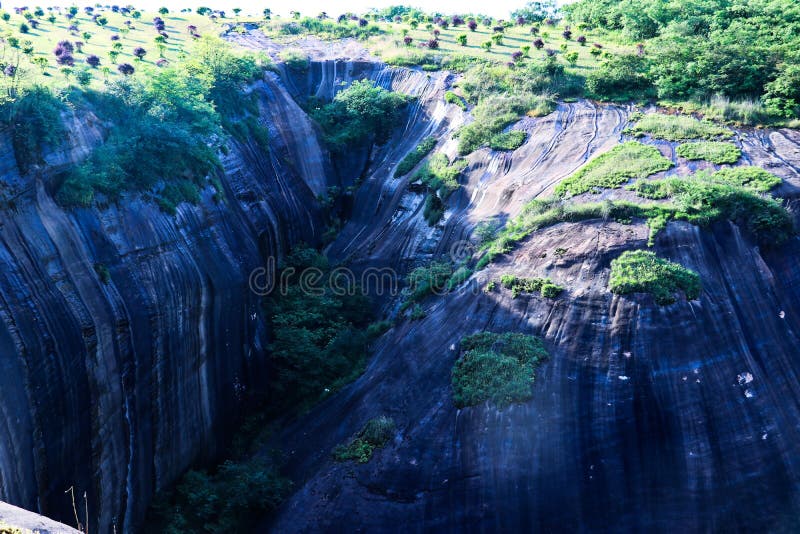 Beautiful View of Abstract Round Cliffs with Thick Green Trees Covering ...