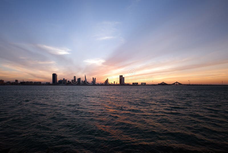 Bahrain skyline at sunset stock image. Image of bahrain - 183191197
