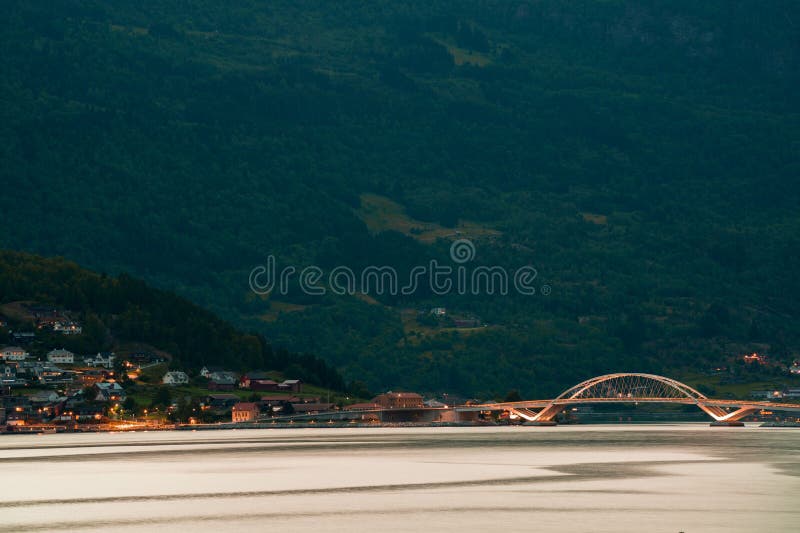 Beautiful View of a Bridge Over the River with Dense Green Forest in ...