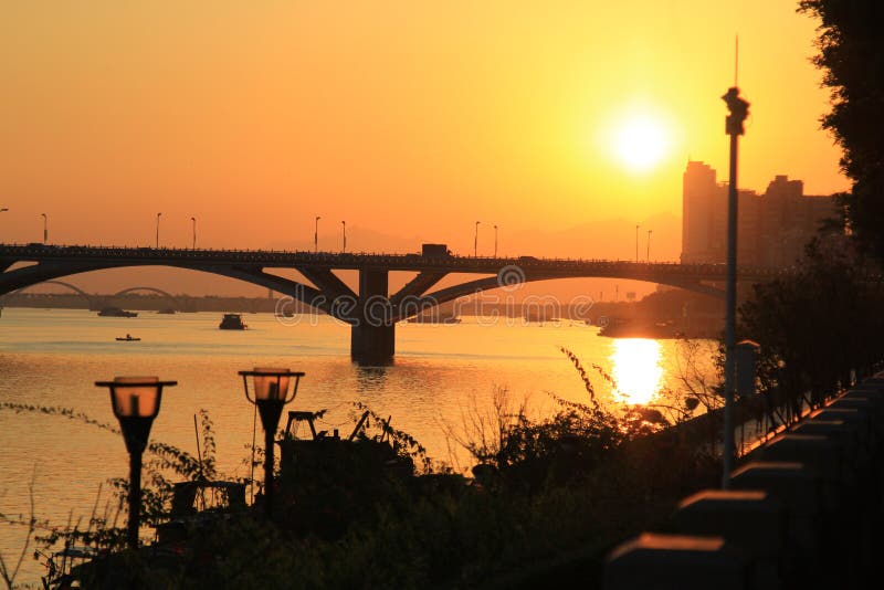 Bridge in the sunset stock image. Image of riverside - 144335065