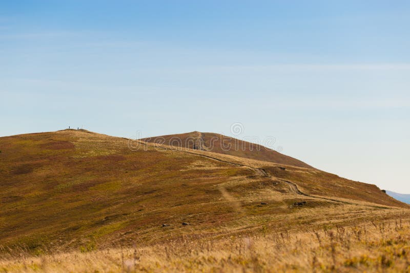 Beautiful View of Brown Mountainside on Blue Sky Background Stock Photo ...