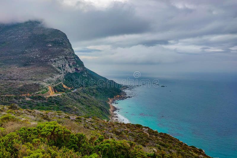 Beautiful View of a Cliff with Trees and Greenery by the Sea Under a ...