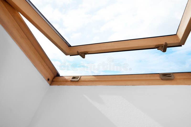 Open Skylight Roof Window on Slanted Ceiling in Attic Room, Low Angle ...