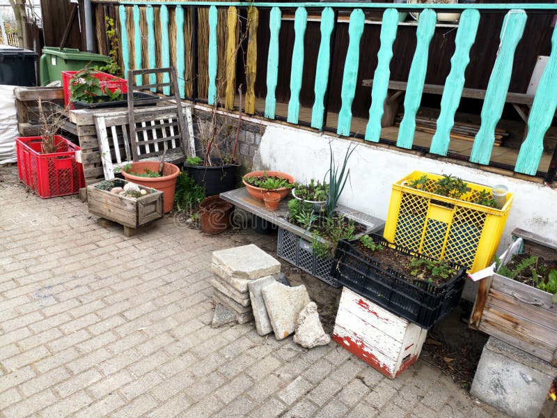 Beautiful View of Clutter with Green Plants in the Plant Boxes and Pots ...