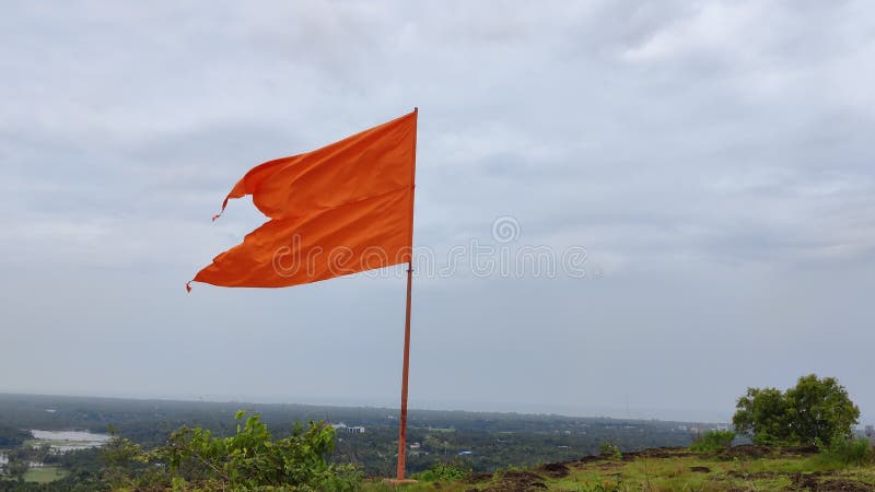 A Beautiful View of a Colored Flag Hoisted on a Flagpole Under the Sky ...