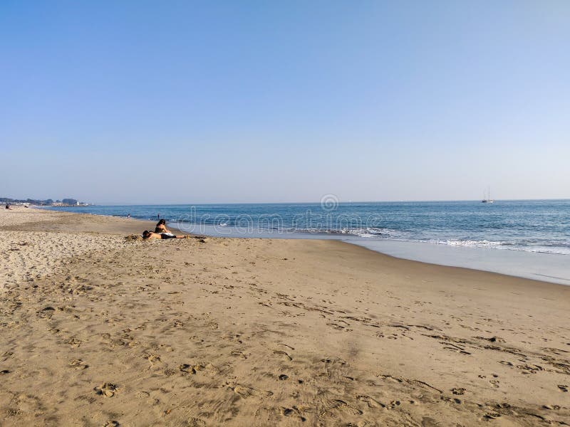 Beautiful View of a Couple on a Sandy Shore on a Beach Stock Photo ...