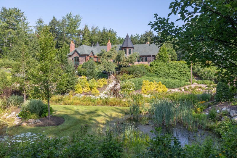 Beautiful View of a Cozy Mansion Surrounded by Evergreen Trees Stock ...