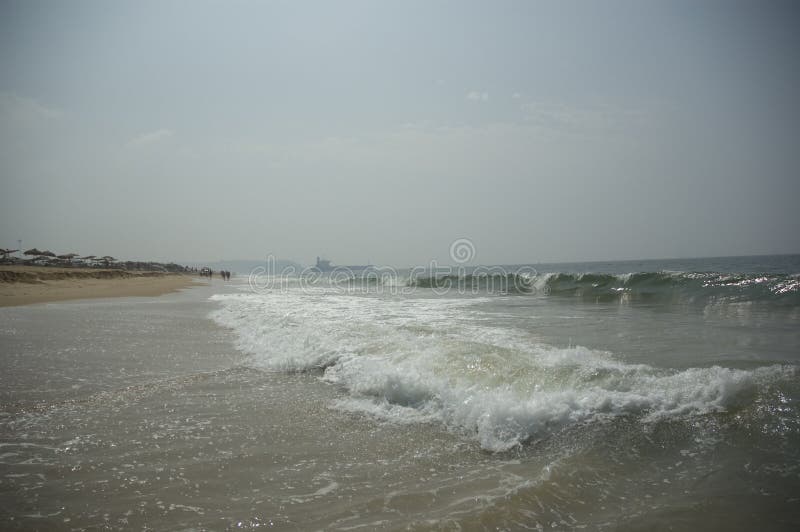 Beautiful View of a Huge Beach and Waves and an Old Ship Stranded Stock ...