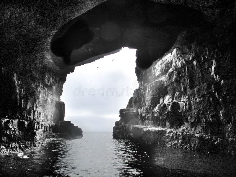 Beautiful View of the Ocean from Inside a Dark Cave in the Arctic Stock ...
