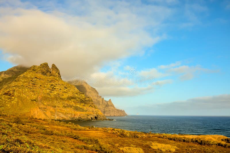 A Beautiful View of the Ocean with a Mountain Range in the Background ...