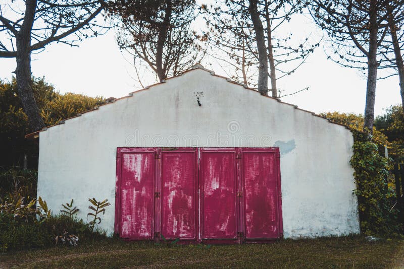 Beautiful View of an Old White Building with Red Gates in the Wood ...