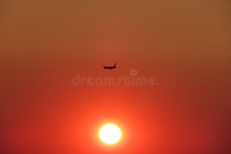 Plane Flight on Orange Sunset Background Stock Photo - Image of pacific ...