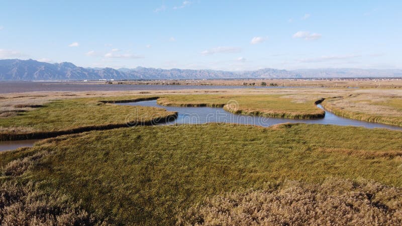 Beautiful View of Prairie Fields with Blue Lake Under Blue Sky with ...