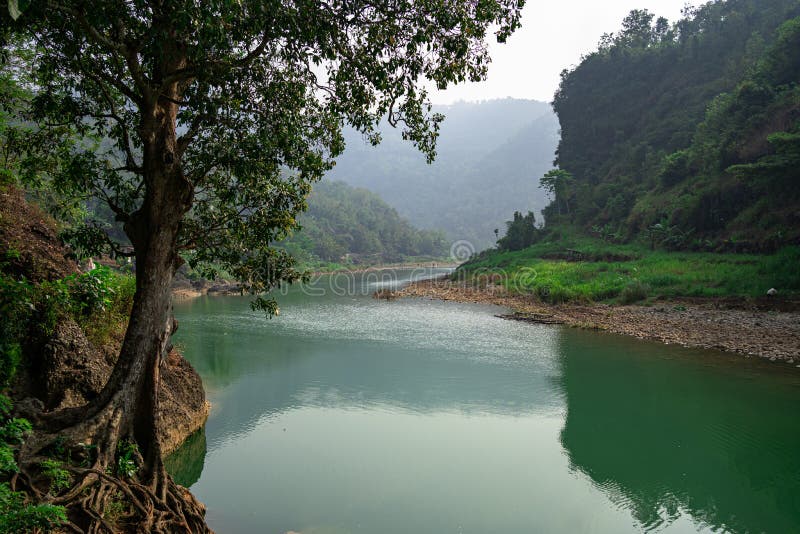 Beautiful View of a Quiet River Surrounded by Fresh Green Grass and ...