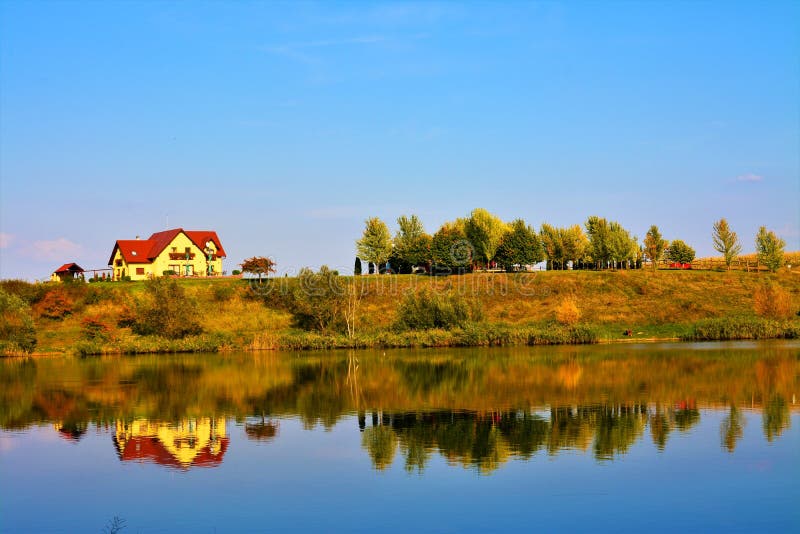Reflection of a House in a Puddle of Water Stock Image - Image of ...