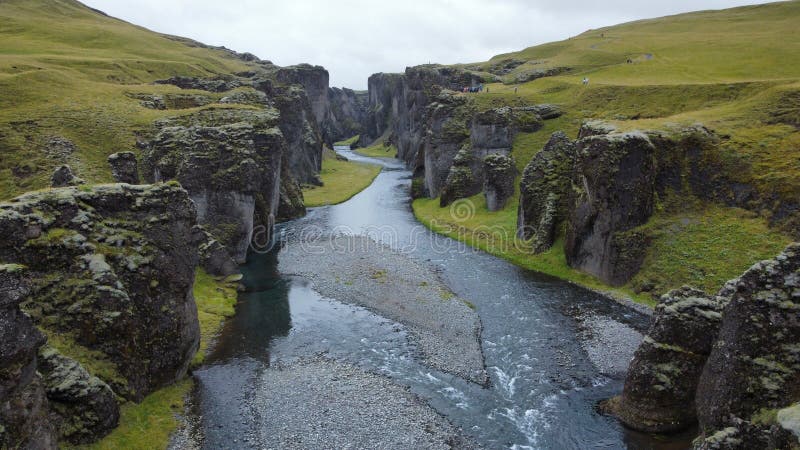 Beautiful View of a River and Cliffs with Greenery Under the Cloudy Sky ...