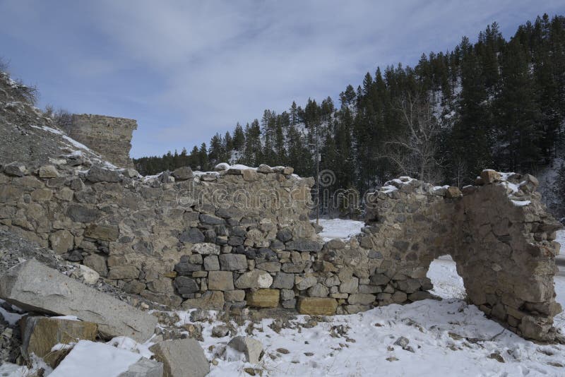 Beautiful View of a Ruined Building on a Snowy Hill with Clouds in the ...