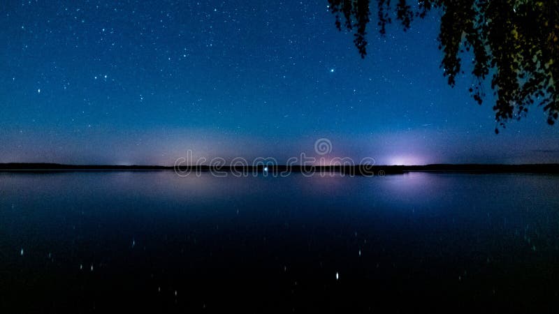 Beautiful View of the Starry Sky Reflected on the Water S Surface ...