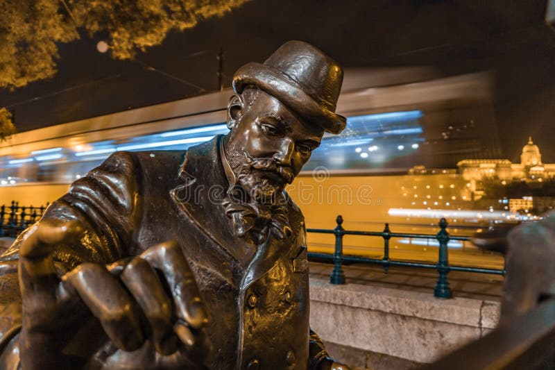 Beautiful View of a Statue in a Park and Train with Long Exposure in a ...